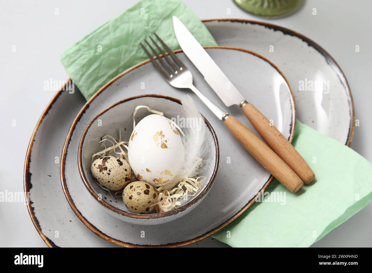 Stylish cute table setting for Easter celebration on grey background ...