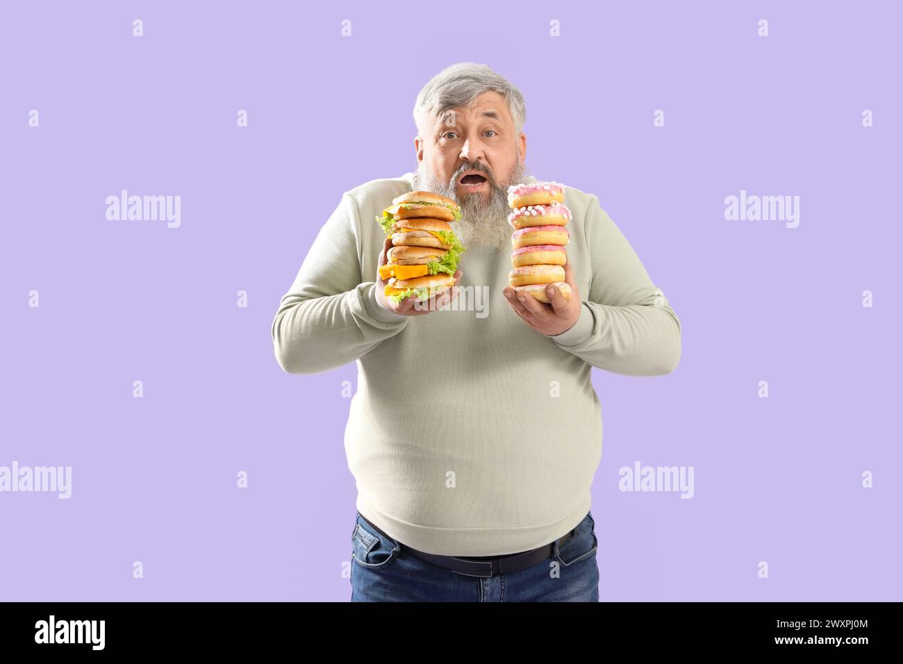 Shocked overweight mature man with burgers and donuts on lilac ...