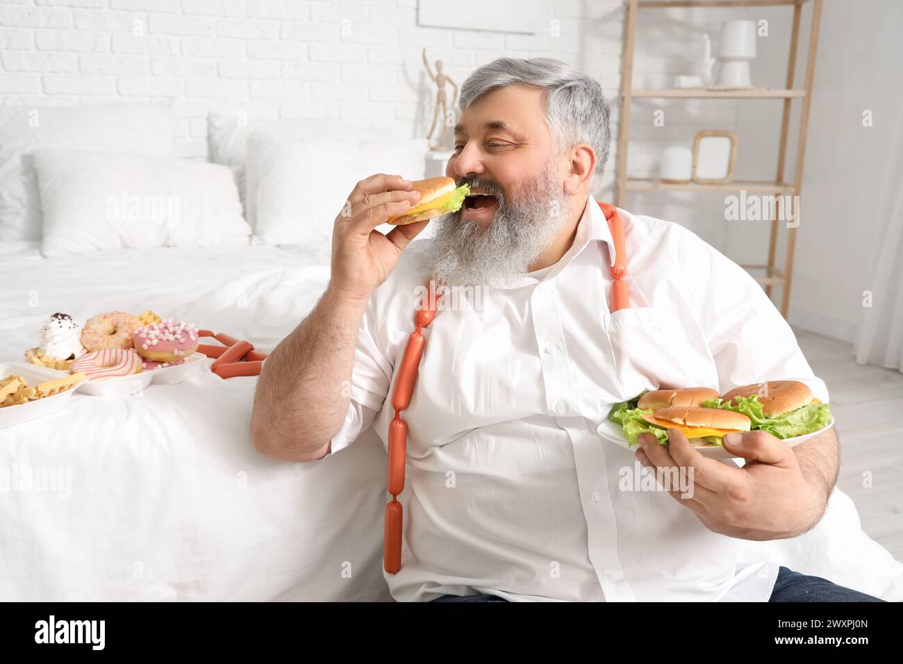 Fat people eating burgers hi-res stock photography and images - Alamy