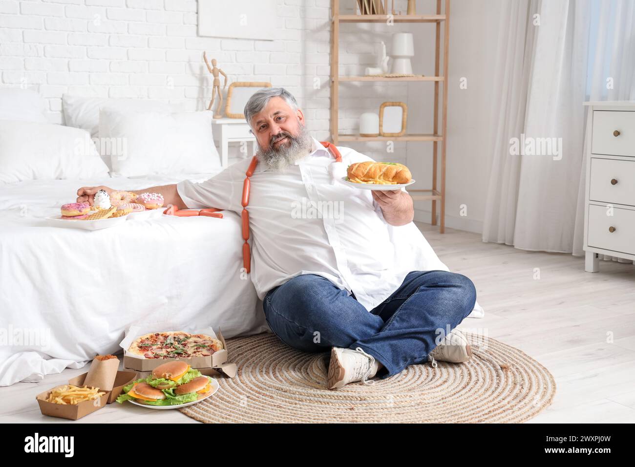 Middle aged overweight man in bed hi-res stock photography and images ...