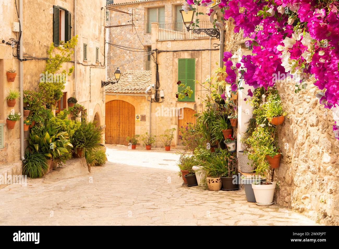 street in old town of Valdemossa with traditional flower pots, Majorca ...
