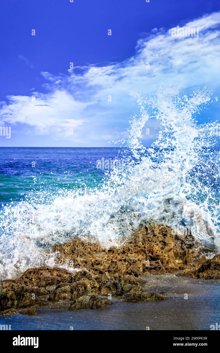 Waves crash against the rocks during high tide at Blowing Rocks Beach Stock Photo - Alamy
