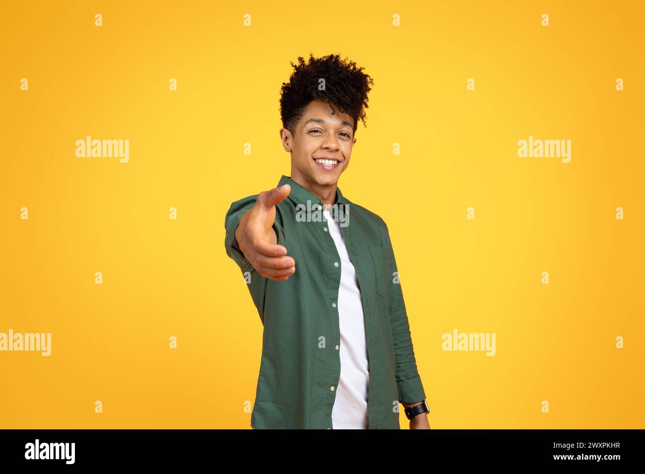 Youthful african american man offering handshake Stock Photo - Alamy