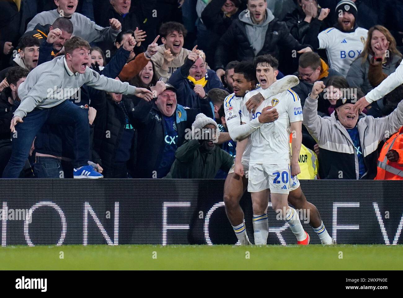Leeds United's Daniel James (right) celebrates scoring their third goal ...