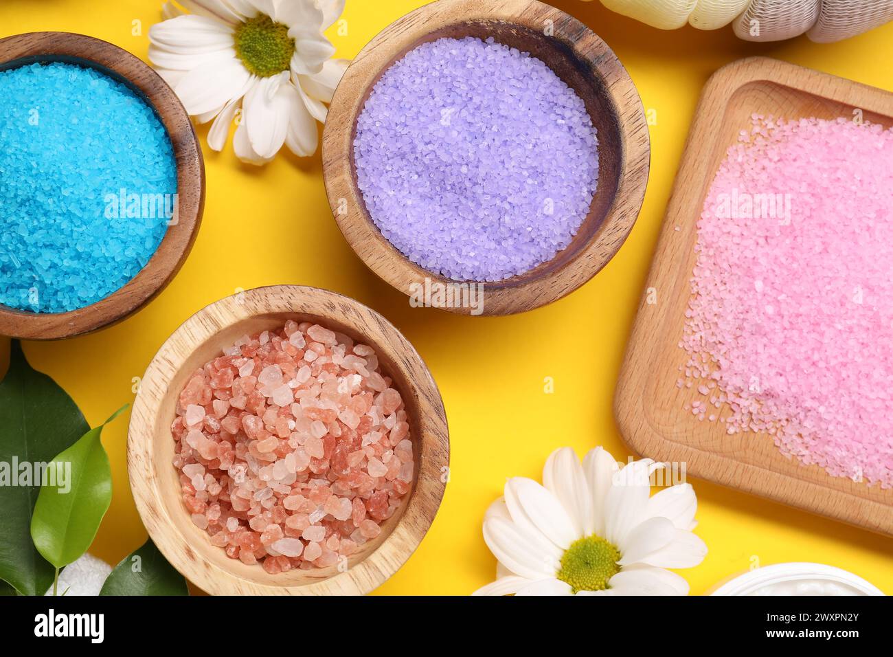Flat lay composition with different sea salt on yellow background Stock ...
