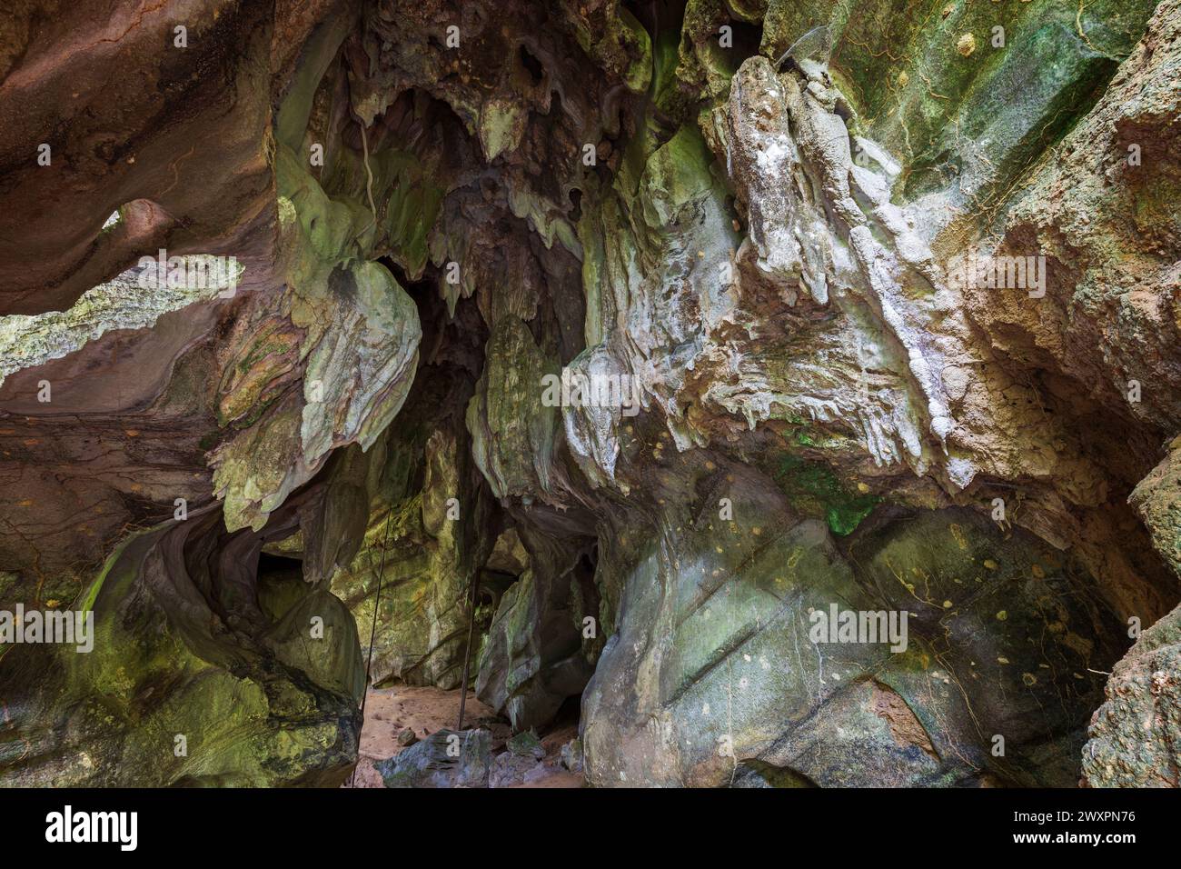 Inside the scenic Khlong Chak Bat Cave with stalactites and other rock ...
