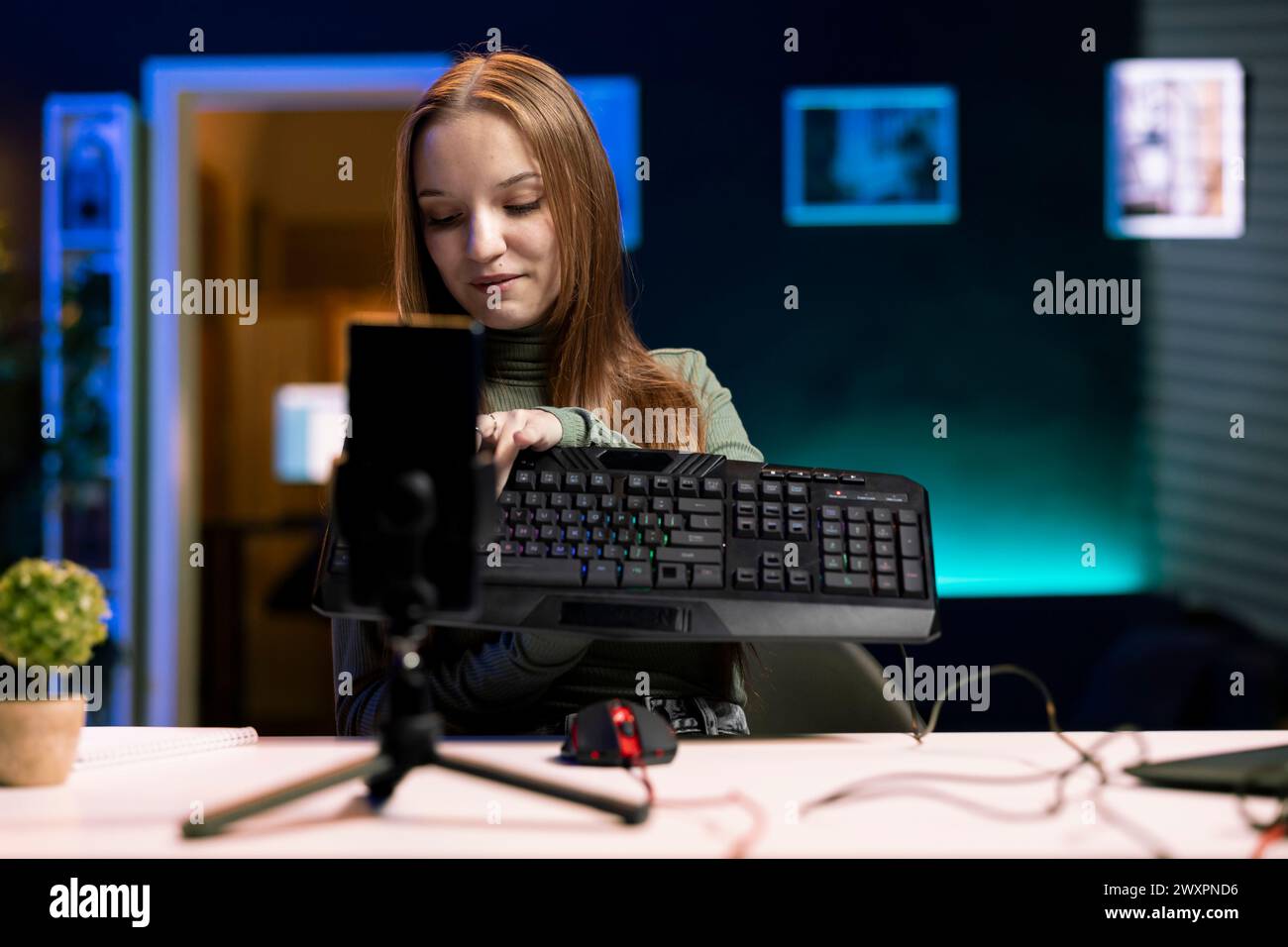 Content creator typing on mechanical keyboard while doing review in ...