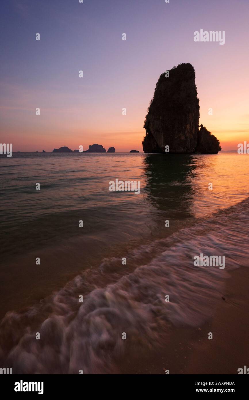 Beautiful view of colorful sky, sea, beach and silhouette of a ...