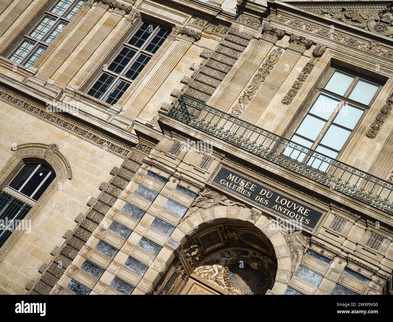 Louvre museum facade with balcony and windows in Paris, France Stock ...
