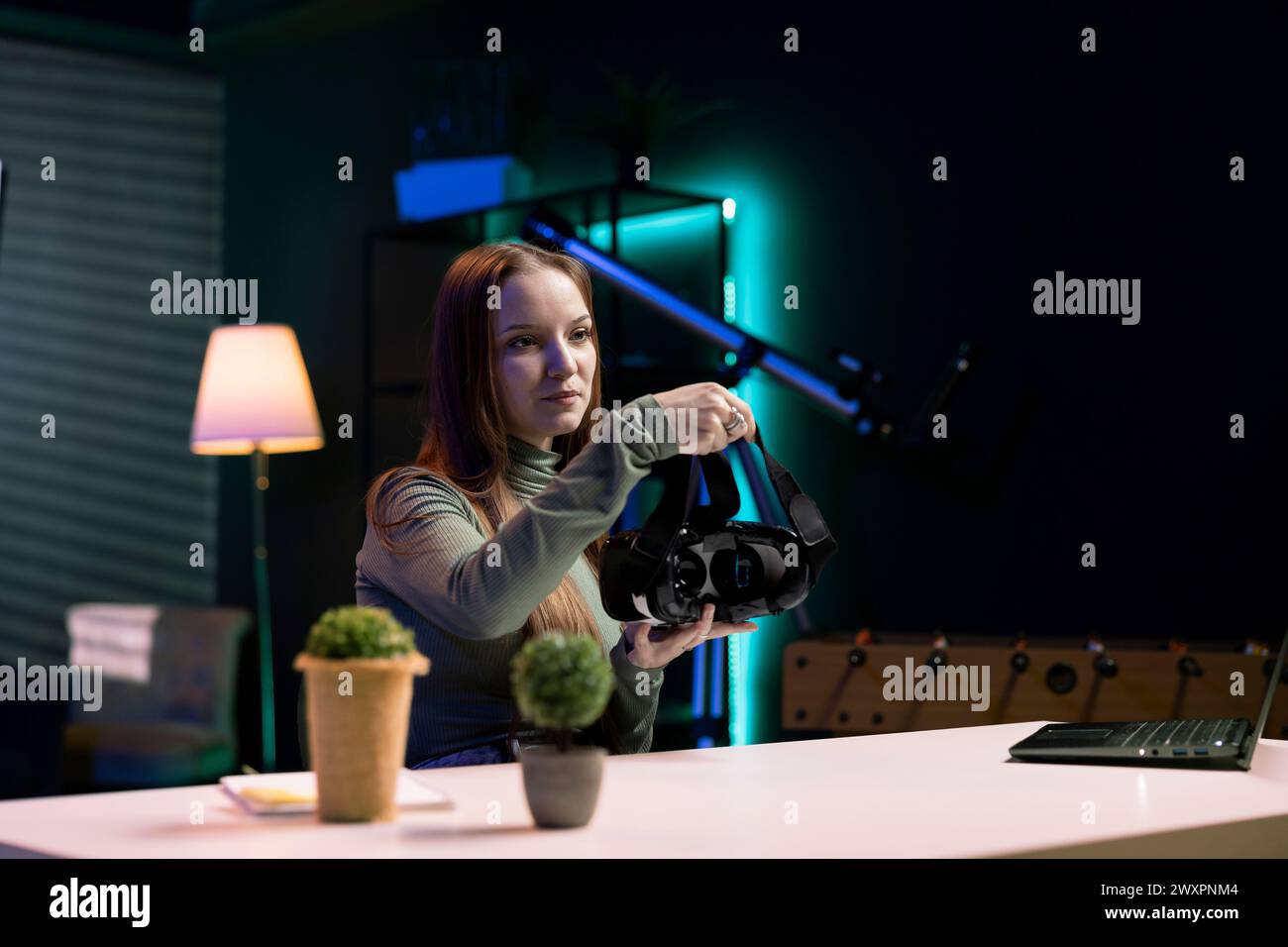 Tech content creator filming technology review of newly released VR ...