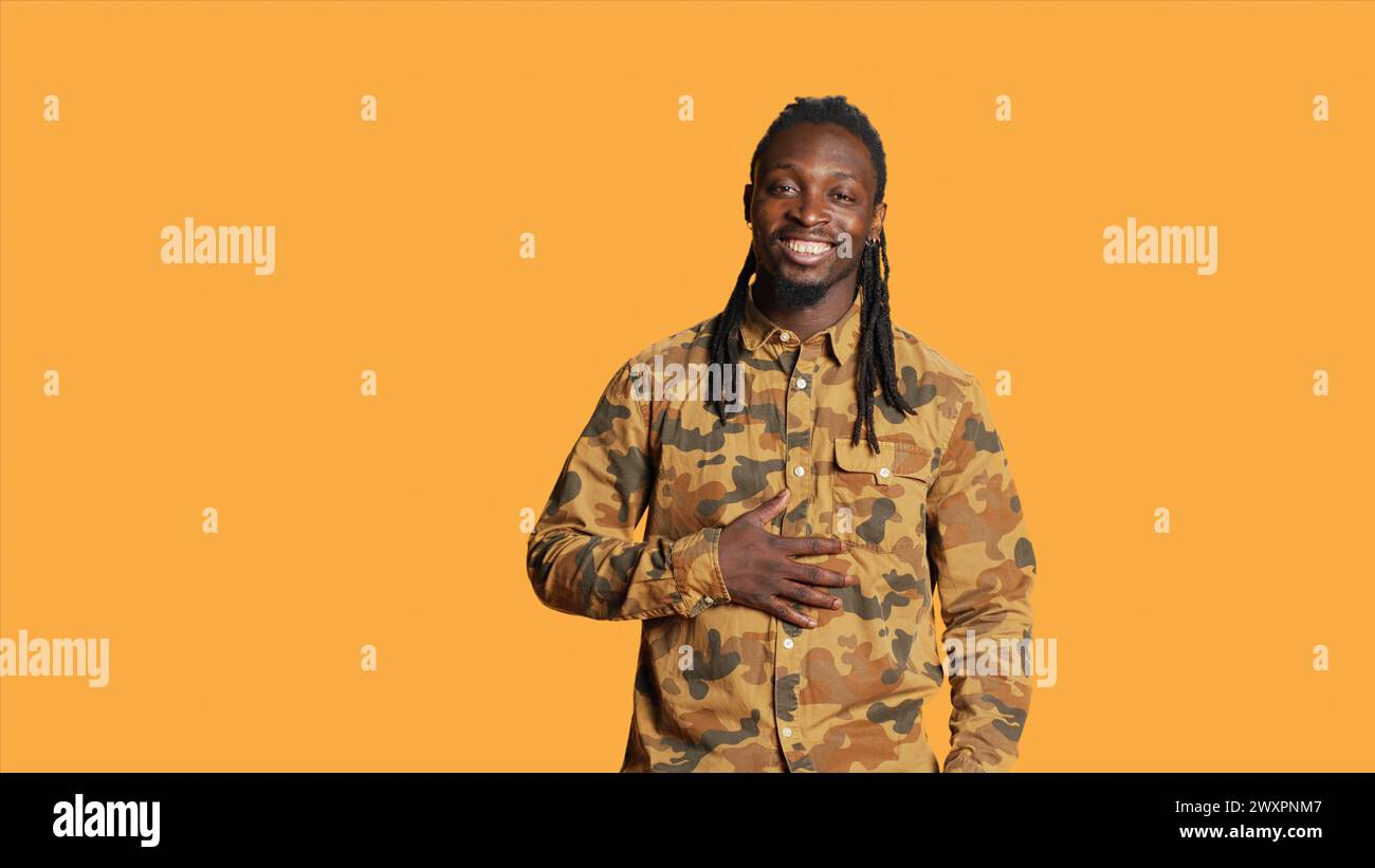 Confident male model laughing at jokes on camera, feeling happy and ...