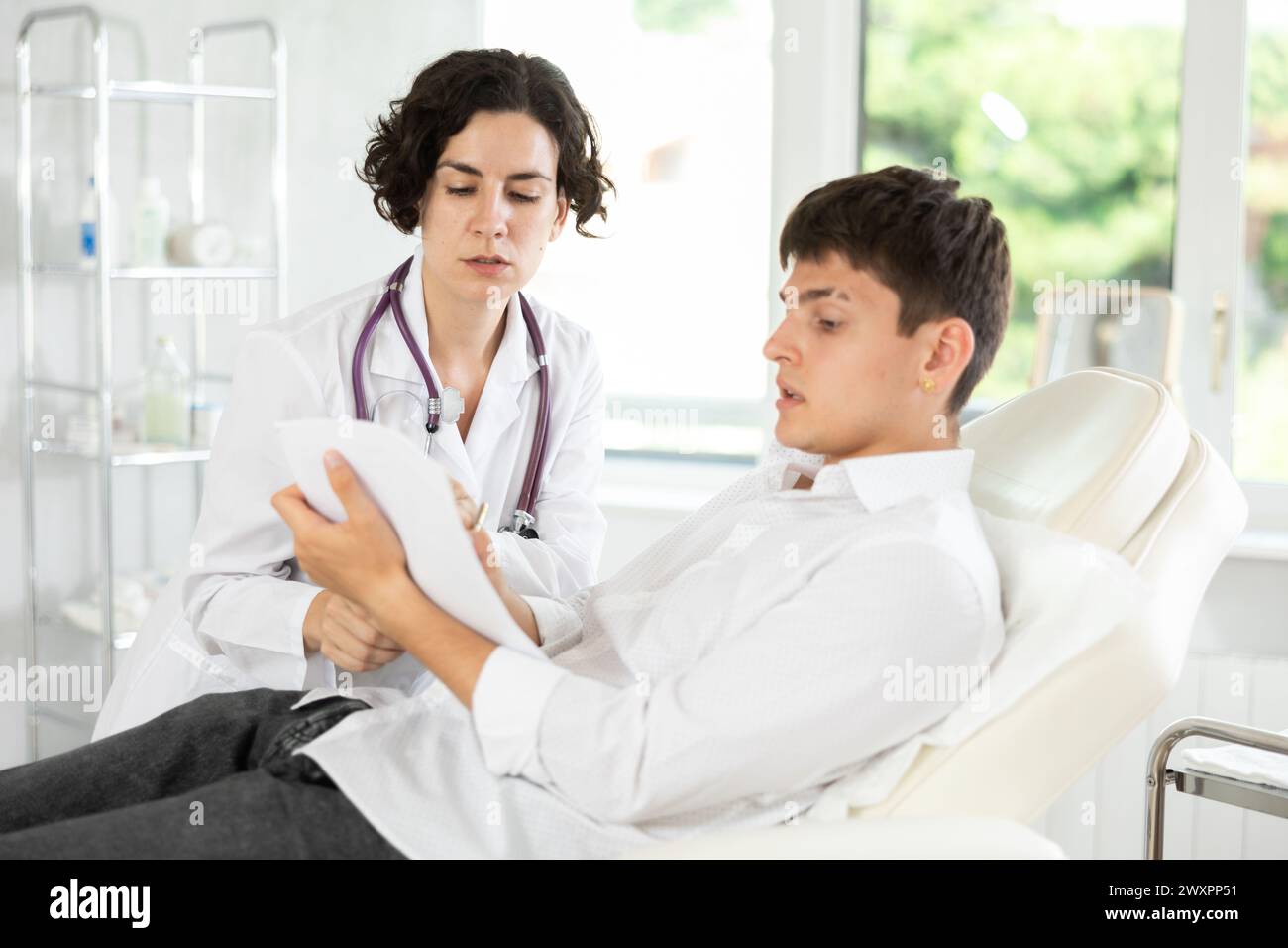 male patient documents signing Stock Photo - Alamy