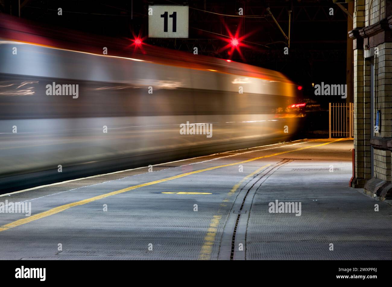 Virgin Trains class 390 Alstom Pendolino train departing into the night ...