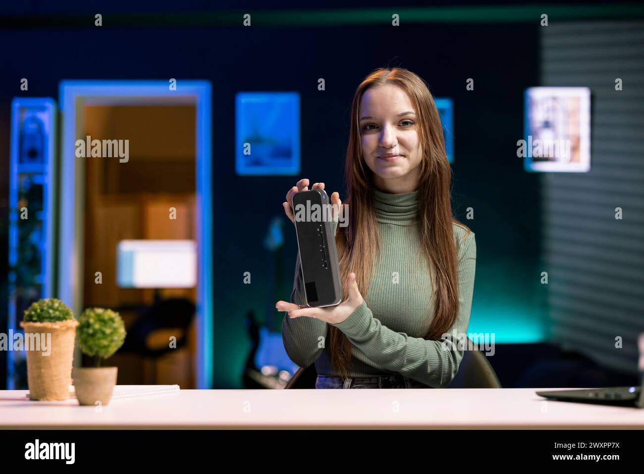 Gen Z media star in home studio filming video about best bluetooth ...