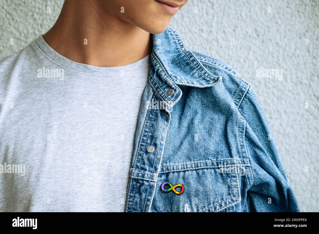 Teenage boy with autism infinity rainbow symbol sign metallic pin ...