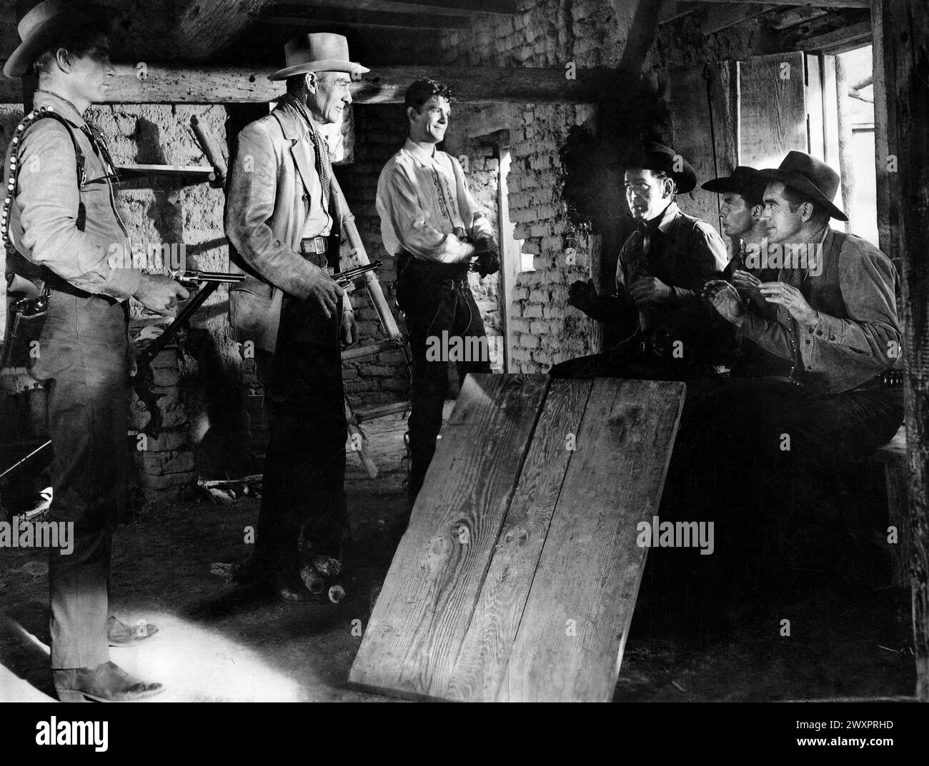 Randolph Scott (center left), Manuel Rojas (center right), on-set of ...
