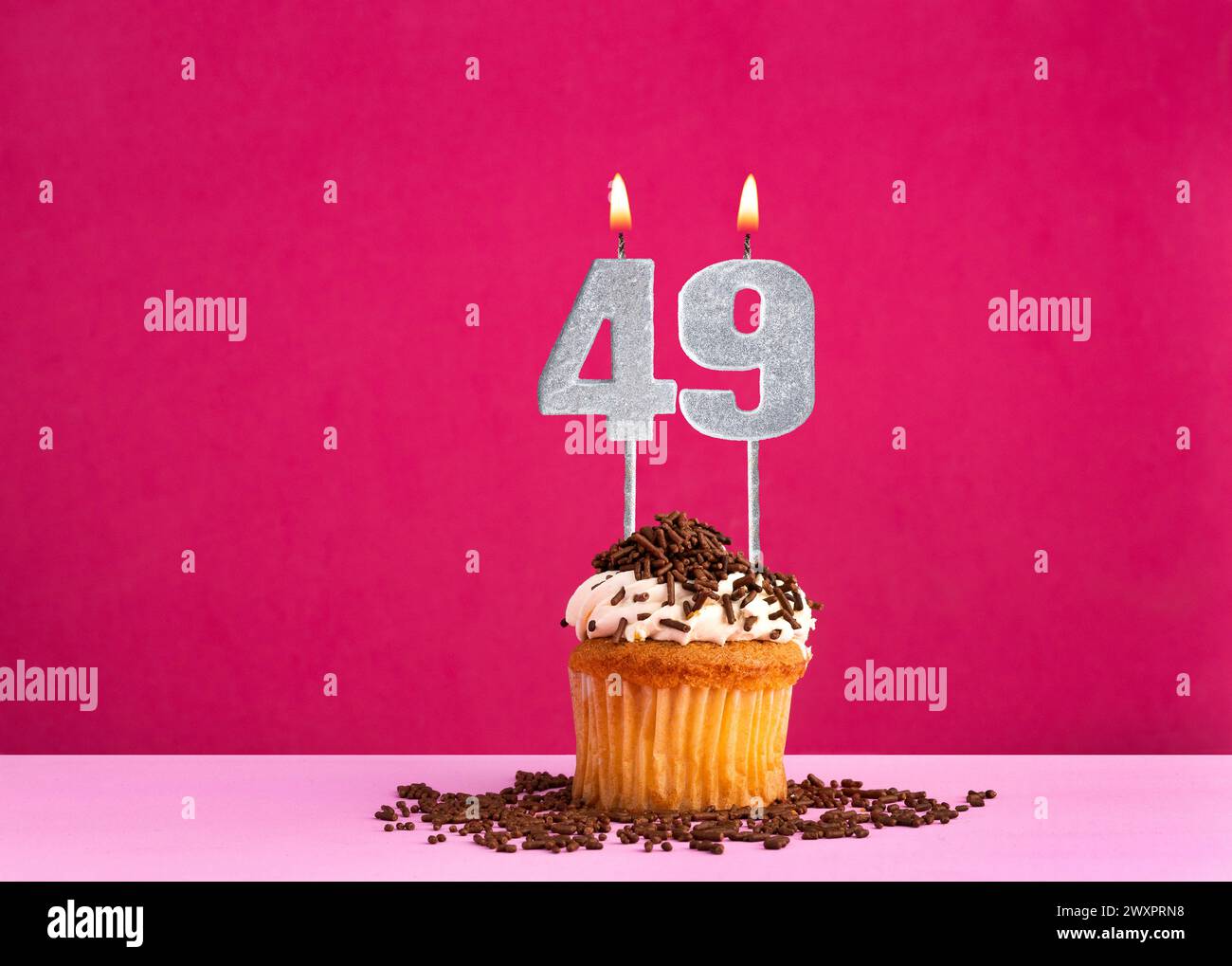 Birthday cupcake with candle number 49 - Birthday card on pink ...