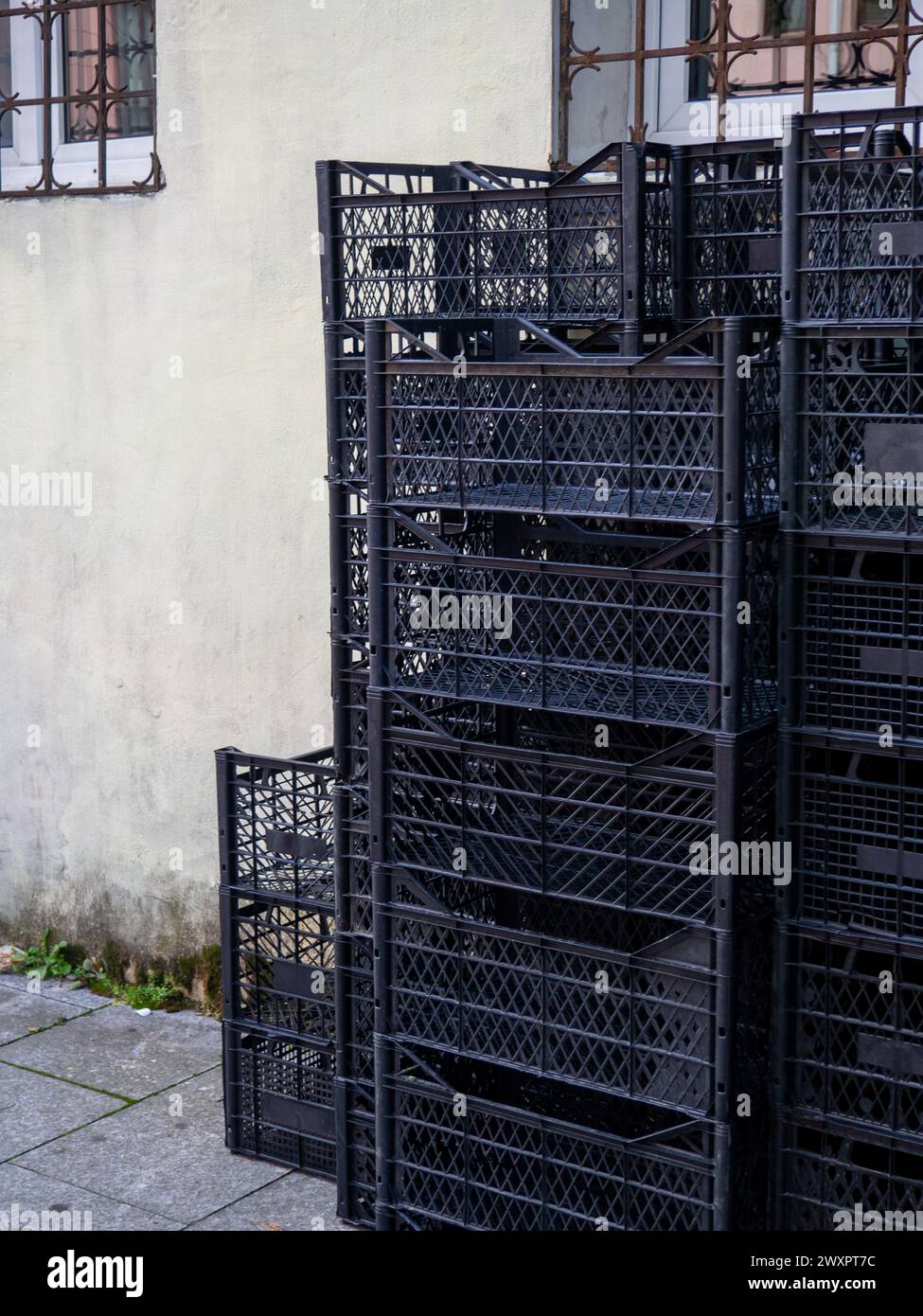 Empty fruit boxes. Lots of black plastic boxes. Transportation Stock ...