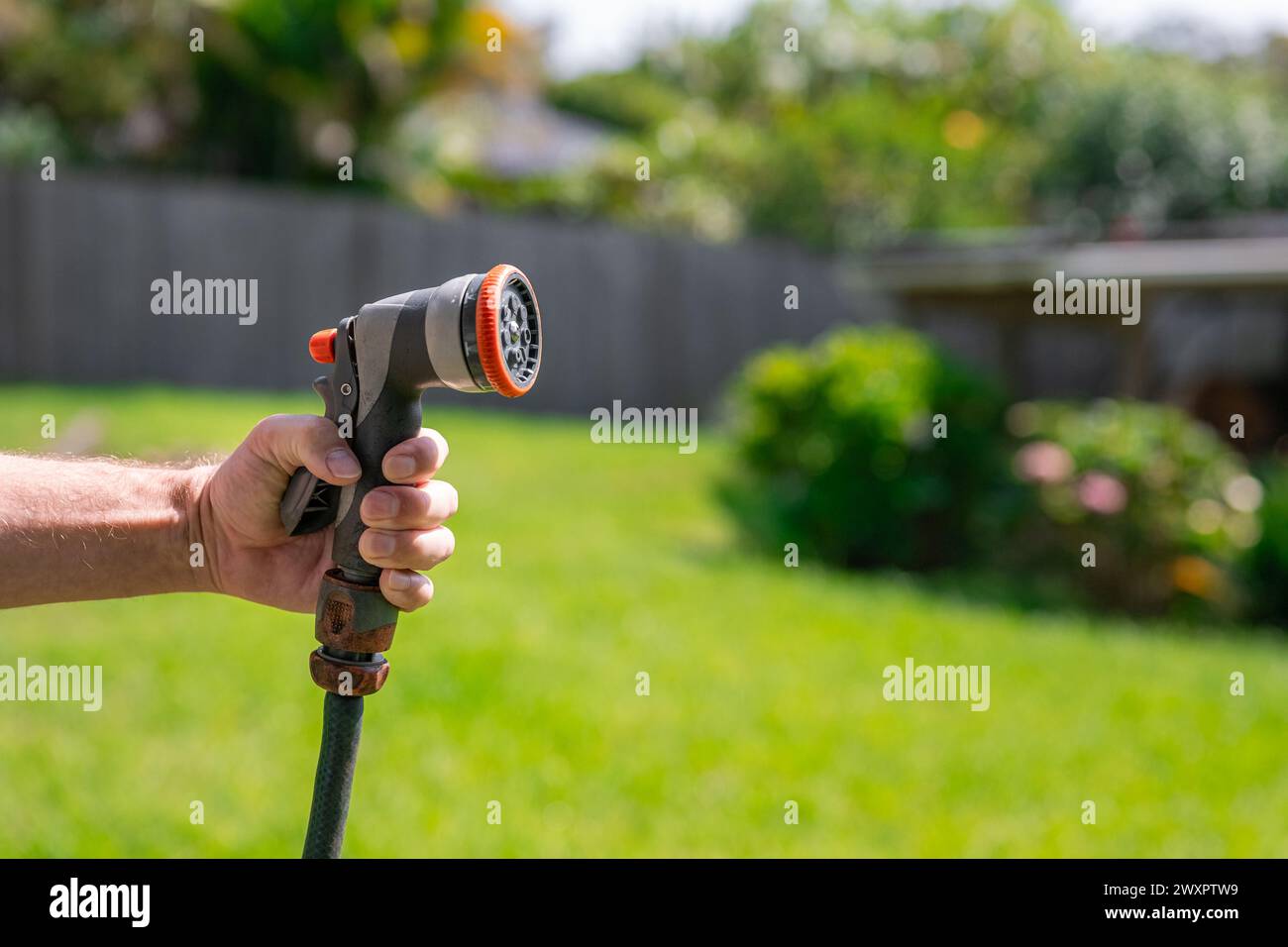 Mans hand holding gun hi-res stock photography and images - Alamy