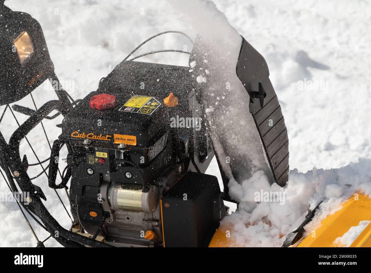 Extreme close-up of use of snowblower to remove snow after winter snow ...