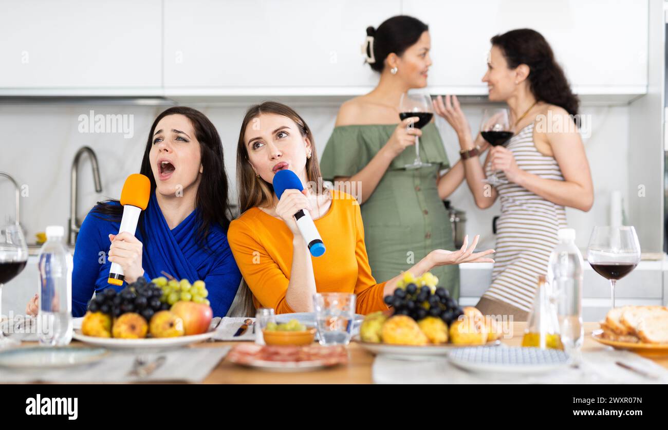 Group of women singing microphones hi-res stock photography and images ...