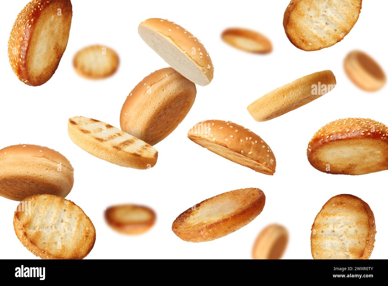Fresh burger buns falling on white background Stock Photo - Alamy