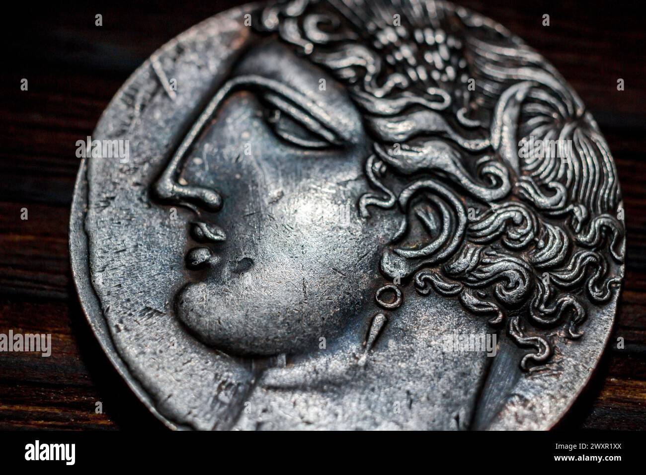 Souvenir Greek coin with the image of the face of the ancient Greek ...