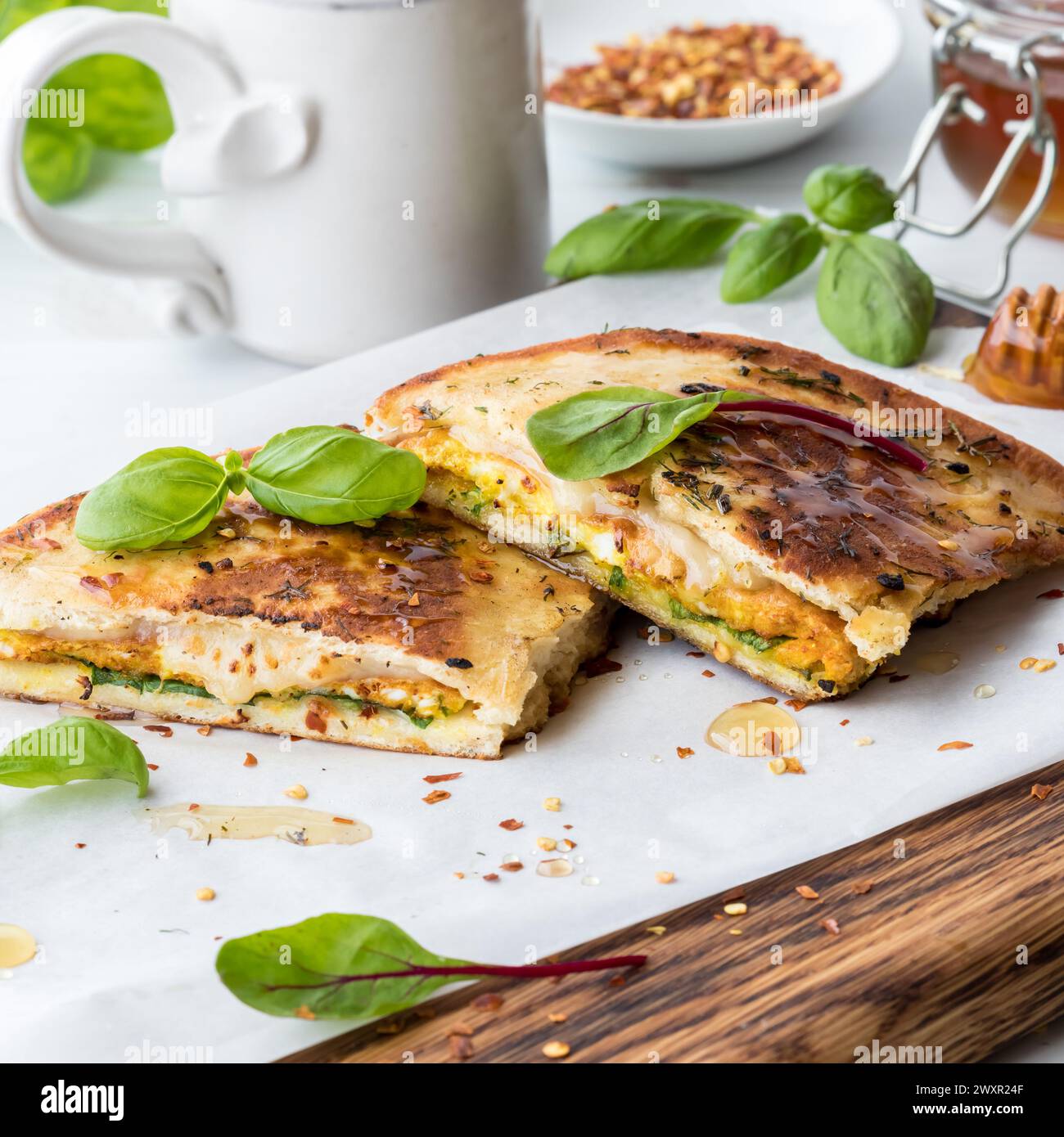 Egg and melted gouda cheese naan bread breakfast sandwiches Stock Photo ...