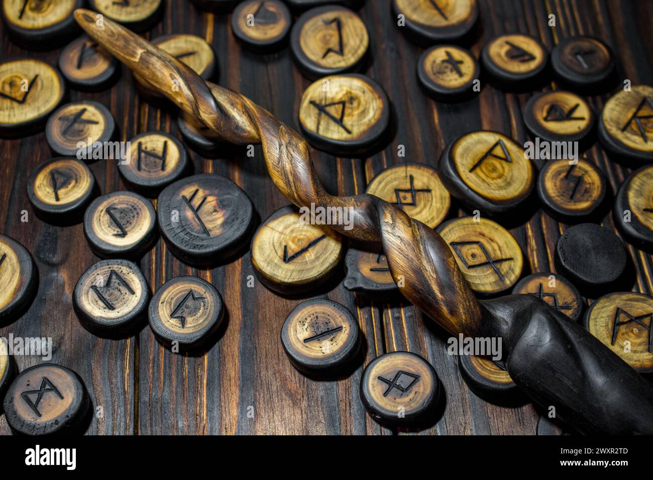 Homemade magic wands and wooden runes on a dark wooden background Stock ...