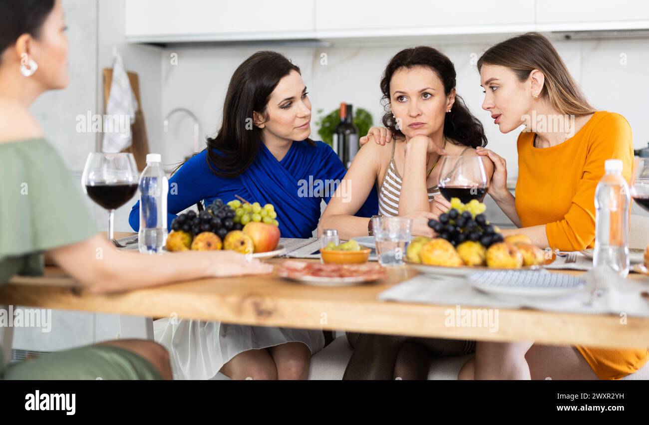 Women calming upset girlfriend at bachelorette party Stock Photo - Alamy