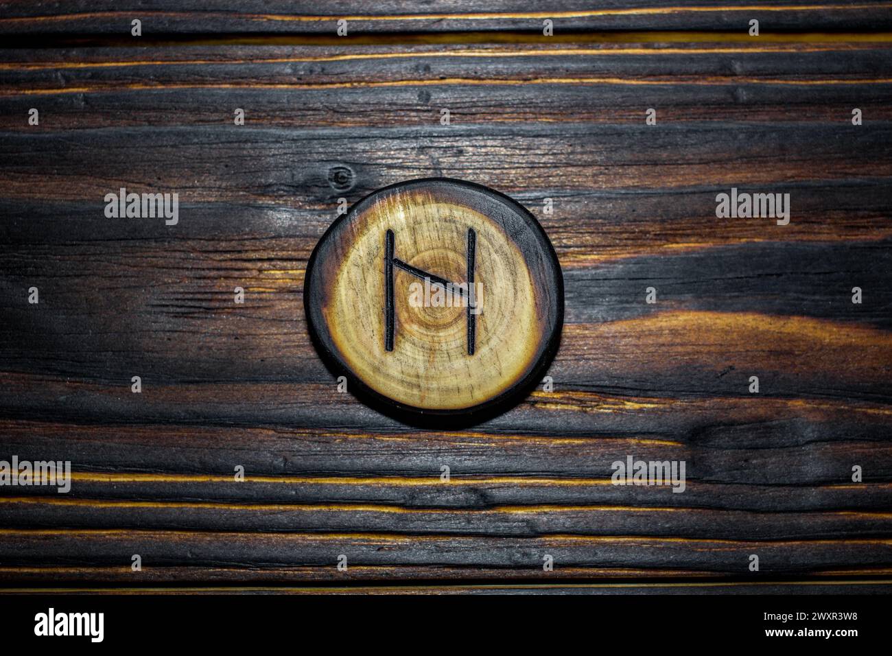 Rune Haglaz (Hagalaz) carved from wood on a wooden background - Elder ...