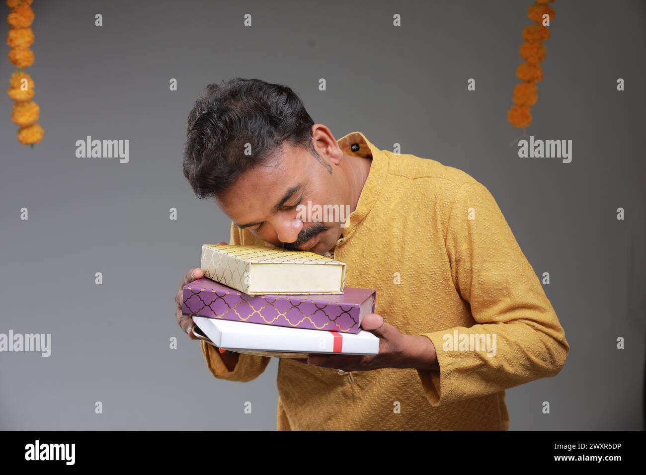 A man with Indian traditional costume, with plain background, isolated ...