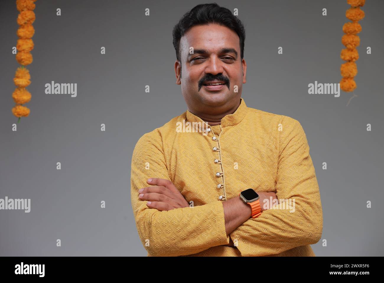 A man with Indian traditional costume, with plain background, isolated ...