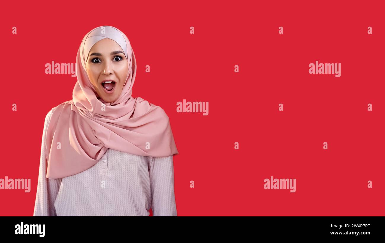 Wow surprise amazed face excited happy woman red Stock Photo - Alamy