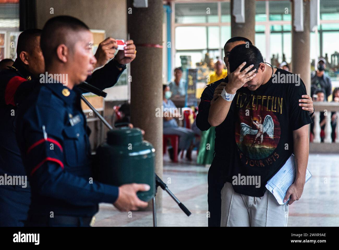 Bangkok, Thailand. 01st Apr, 2024. A Thai man reacts after drawing a ...