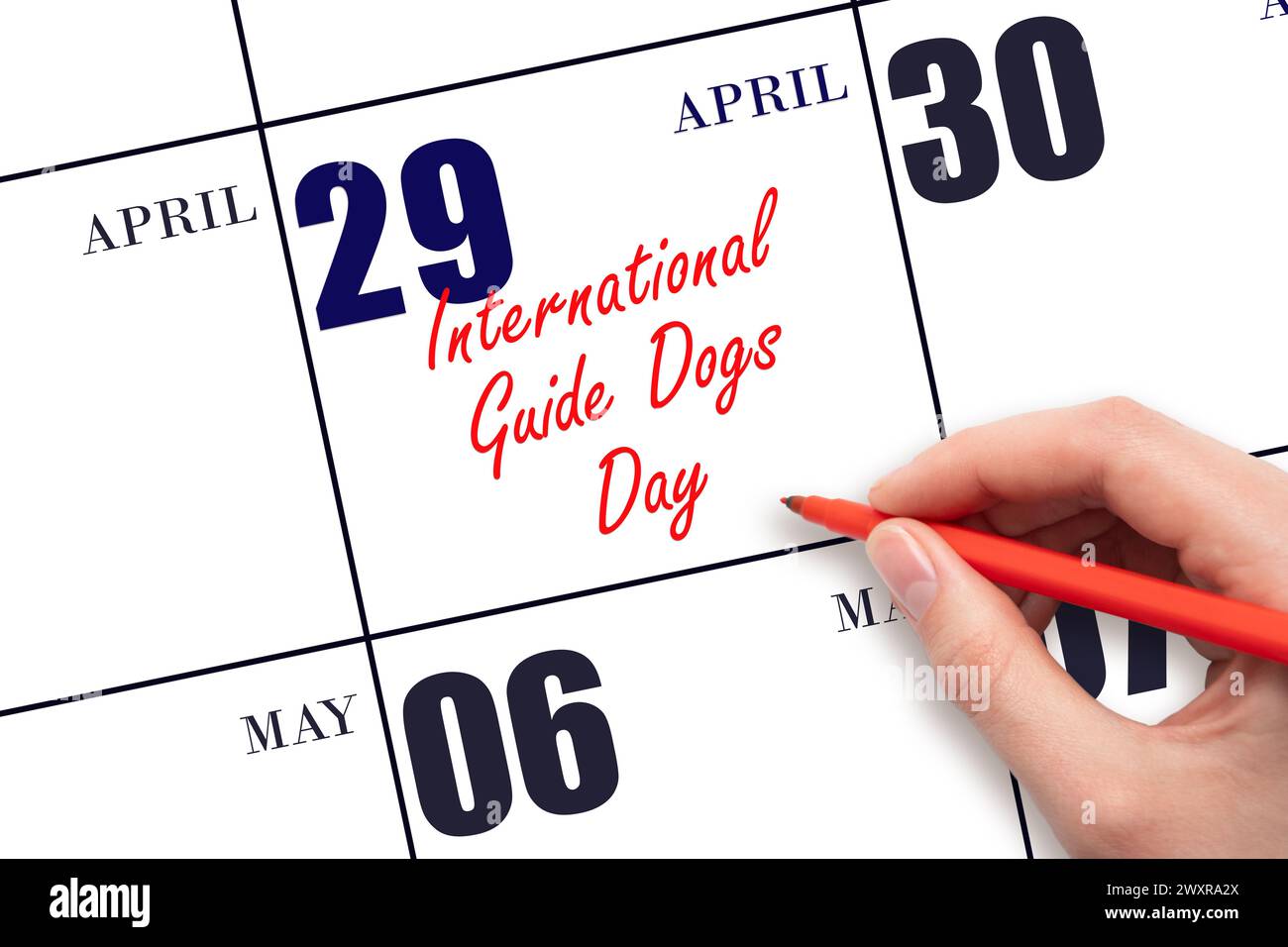 April 29. Hand writing text International Guide Dogs Day on calendar ...