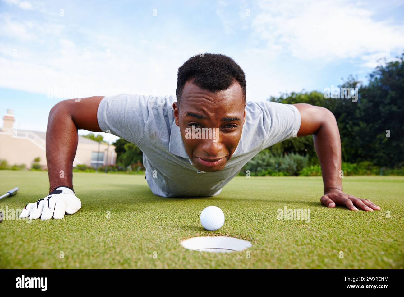 Man, disappointed and miss hole in golf, sad for fail or loss with ...