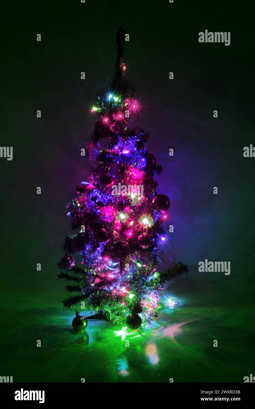 christmas tree from the color lights in the night Stock Photo - Alamy