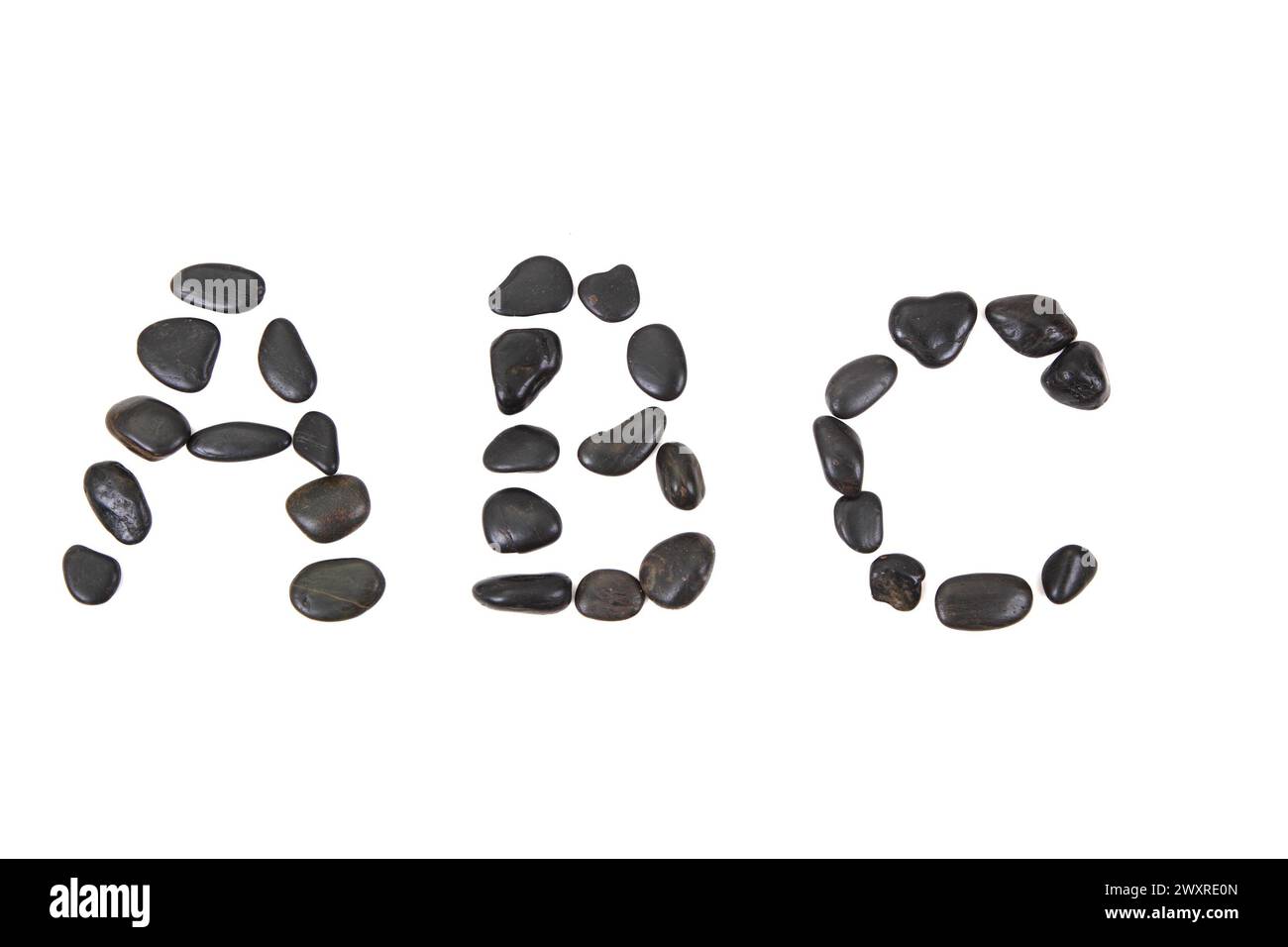 stone alphabet from black stones isolated on the white background Stock ...