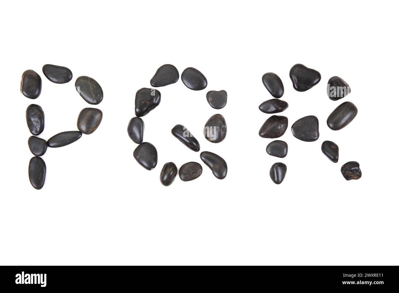 stone alphabet from black stones isolated on the white background Stock ...