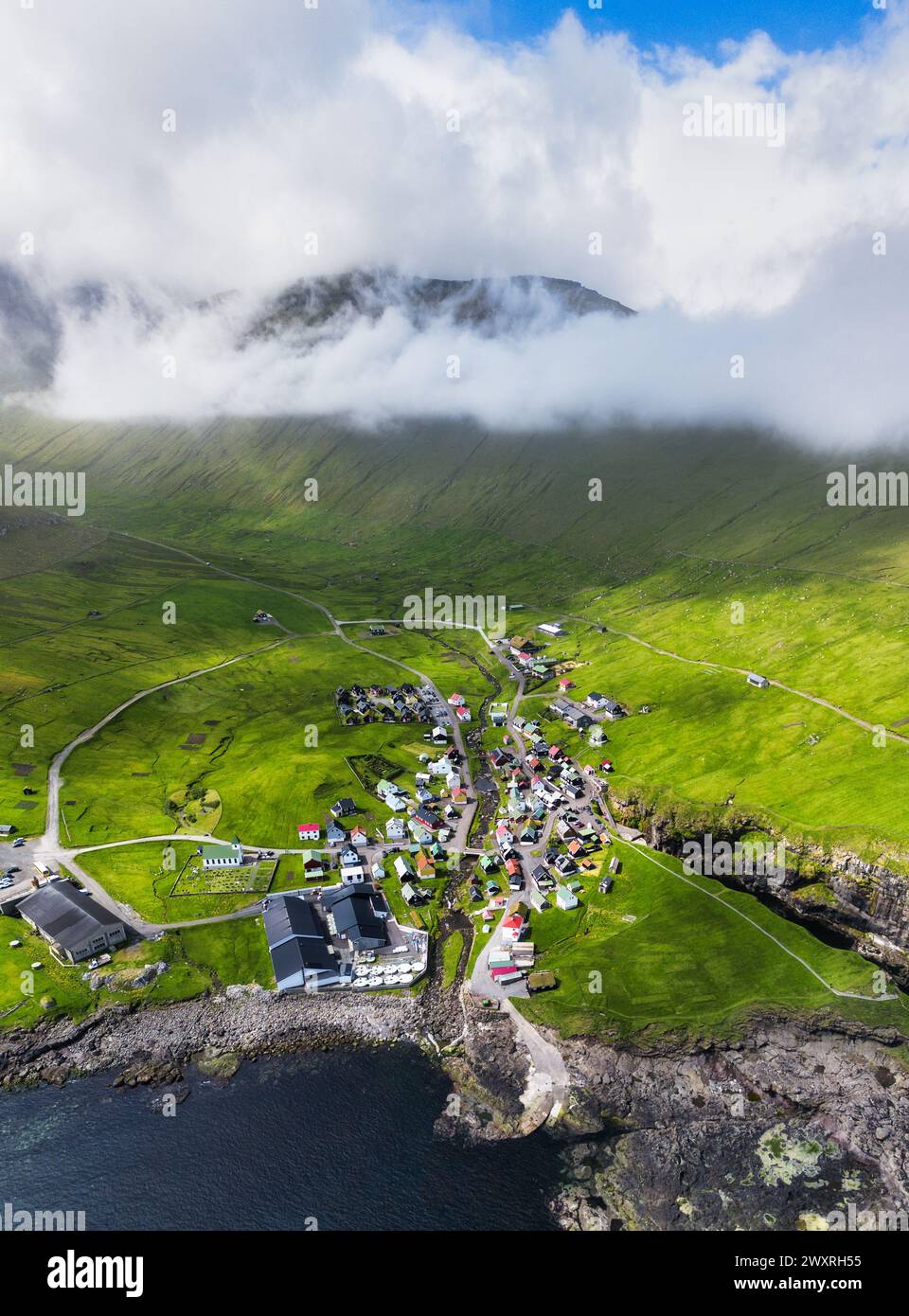 Drone view of Village of Gjogv on Faroe Islands with colourful houses ...