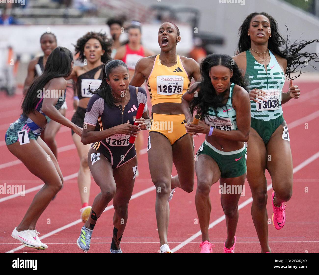 Shamier Little (12675) and Alexis Holmes (13038) pass relay batons to ...