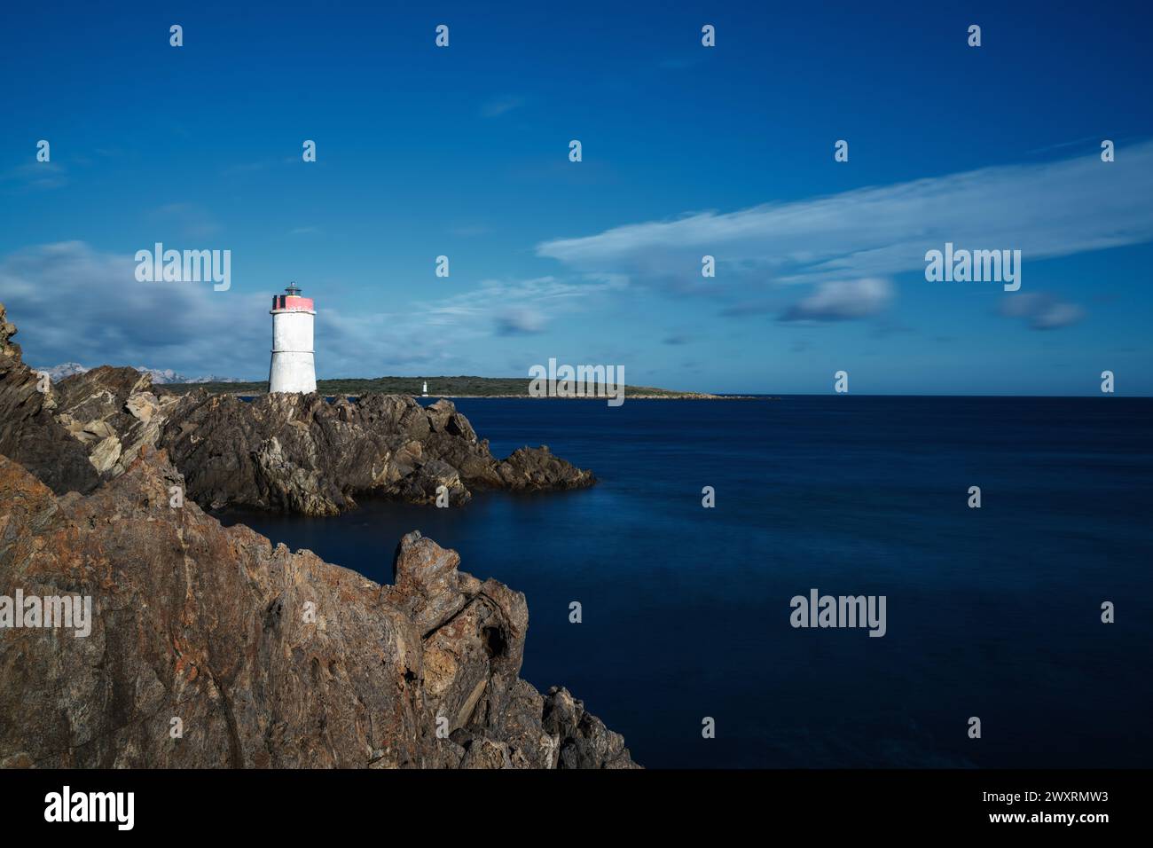 A landscape view of the old Capo Ferro Lighthouse in Sardinia Stock ...