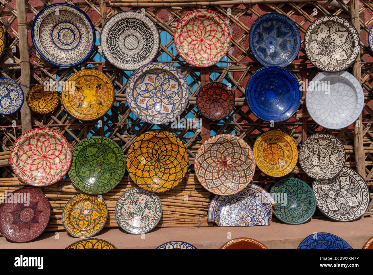 Many colorful bowls and platters on display in a traditional Moroccan ...