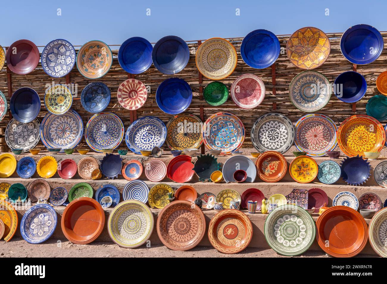 Many colorful bowls and platters on display in a traditional Moroccan ...