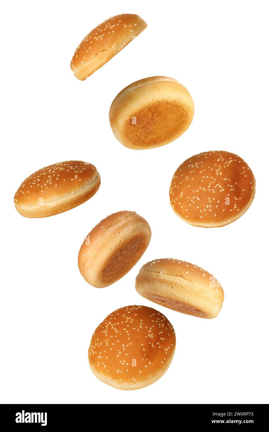 Fresh burger buns falling on white background Stock Photo - Alamy