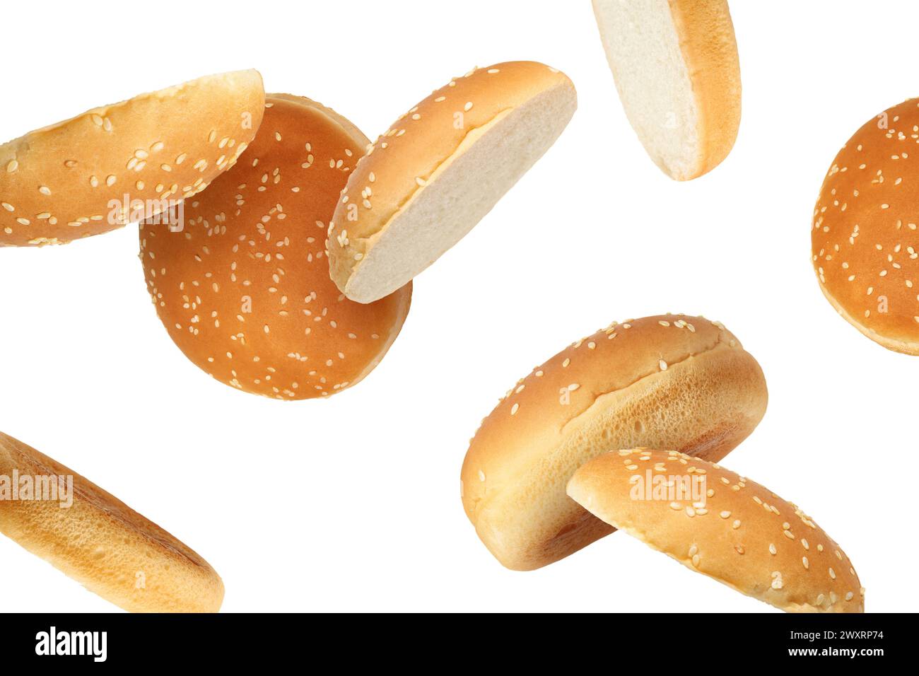 Fresh burger buns falling on white background Stock Photo - Alamy