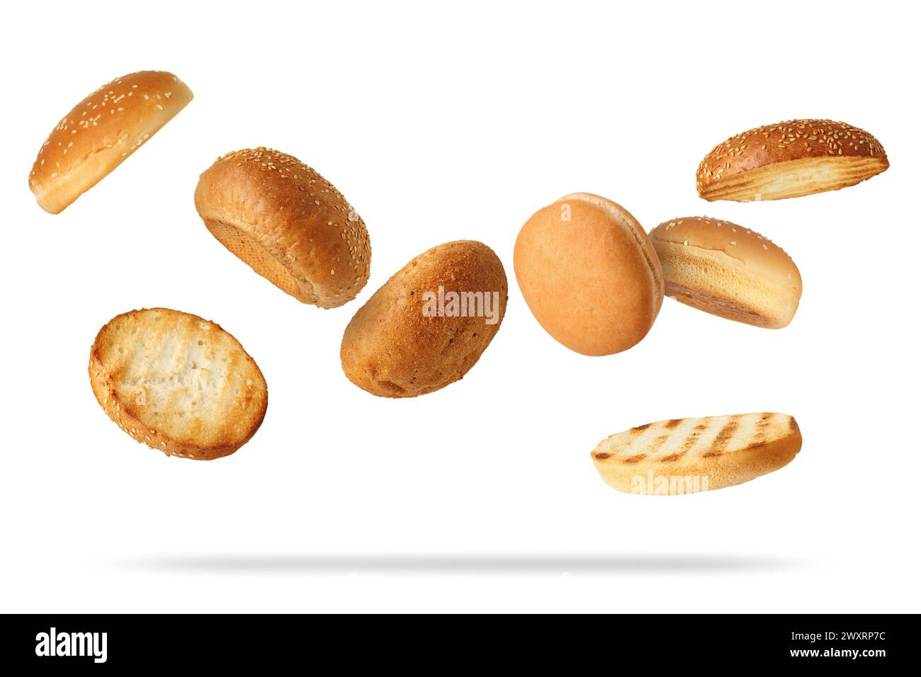 Fresh burger buns falling on white background Stock Photo - Alamy