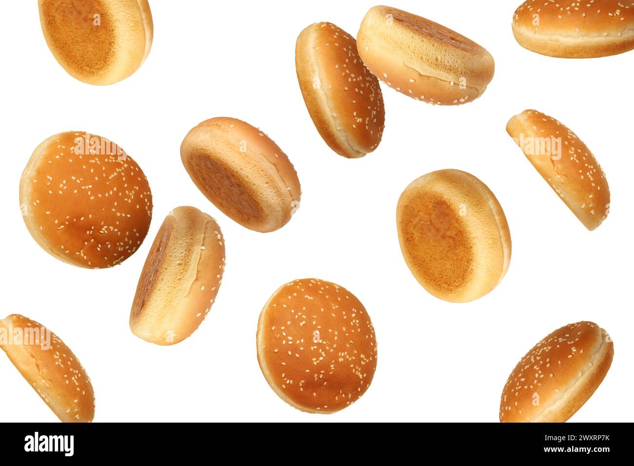 Fresh burger buns falling on white background Stock Photo - Alamy