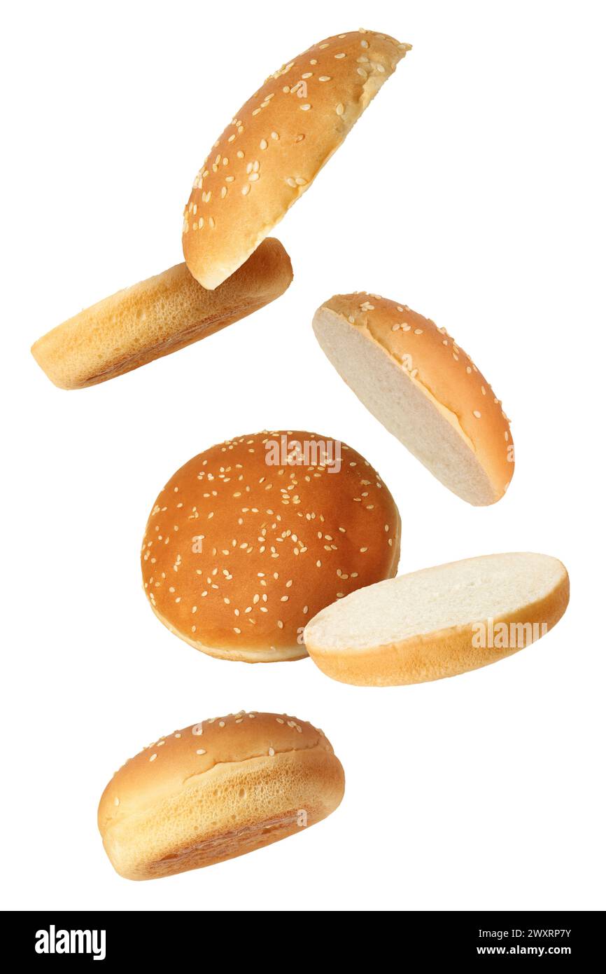 Fresh burger buns falling on white background Stock Photo - Alamy